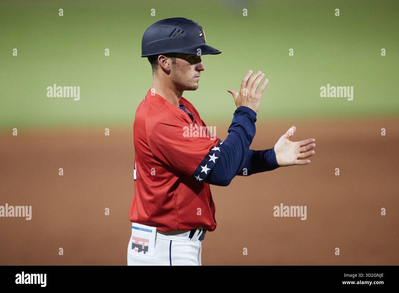 Charleston RiverDogs manager Blake Butera (3) coaches third base during ...
