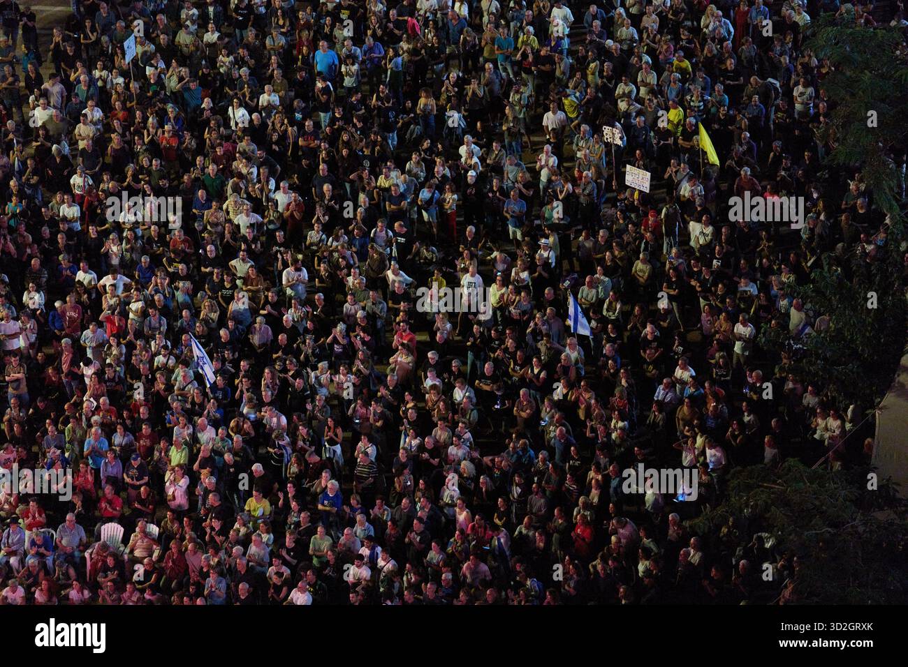 People attend a rally in Tel Aviv, Israel, on Saturday, Nov. 1, 2025 ...