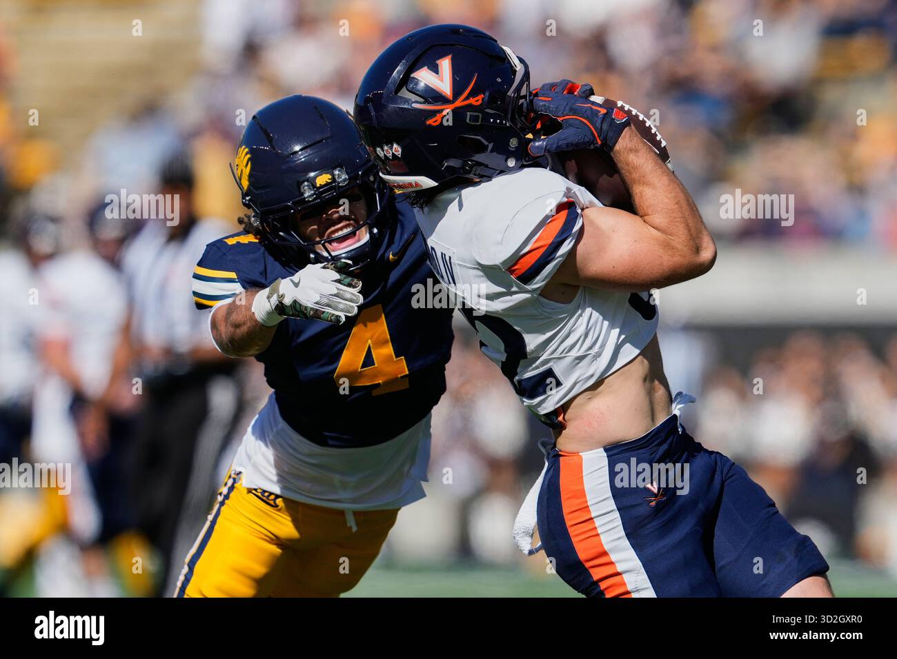Virginia wide receiver Eli Wood, right, catches a pass while defended ...