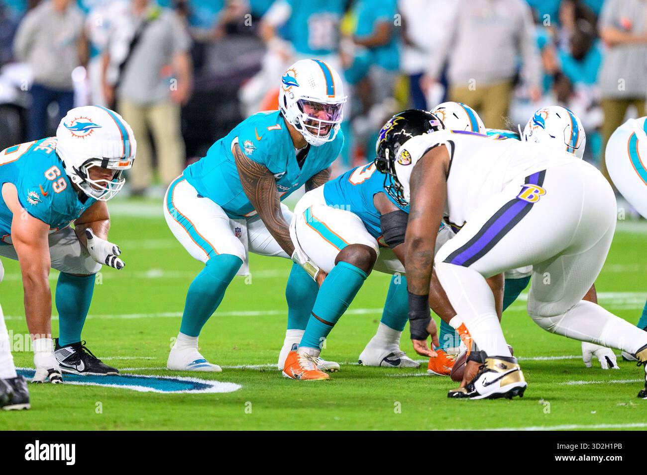 Miami Dolphins quarterback Tua Tagovailoa (1) prepares to take the snap ...