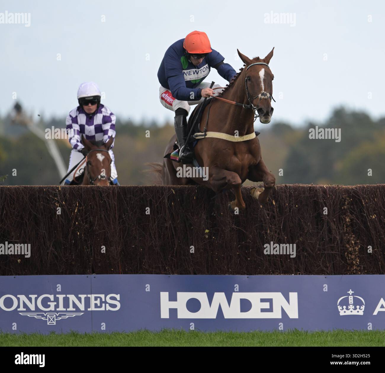 Ascot, UK. 1 November, 2025. No Questions Asked (orange cap) ridden by ...