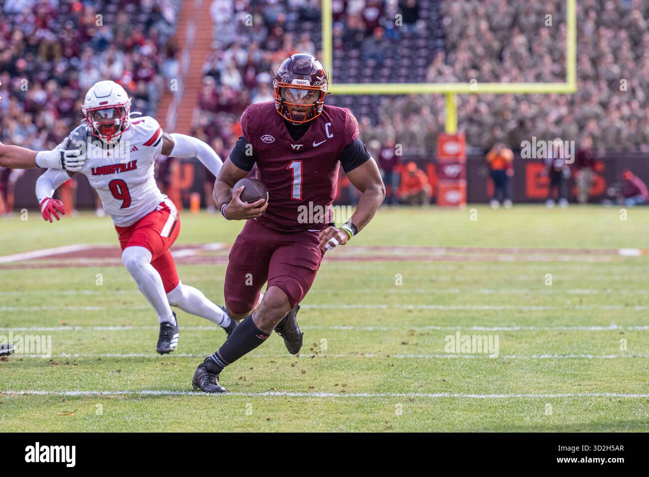 Virginia Tech quarterback Kyron Drones (1) runs in for a touchdown ...