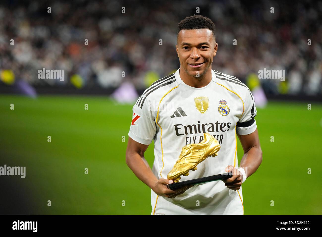 Real Madrid's Kylian Mbappe poses with the Golden Boot award before the ...