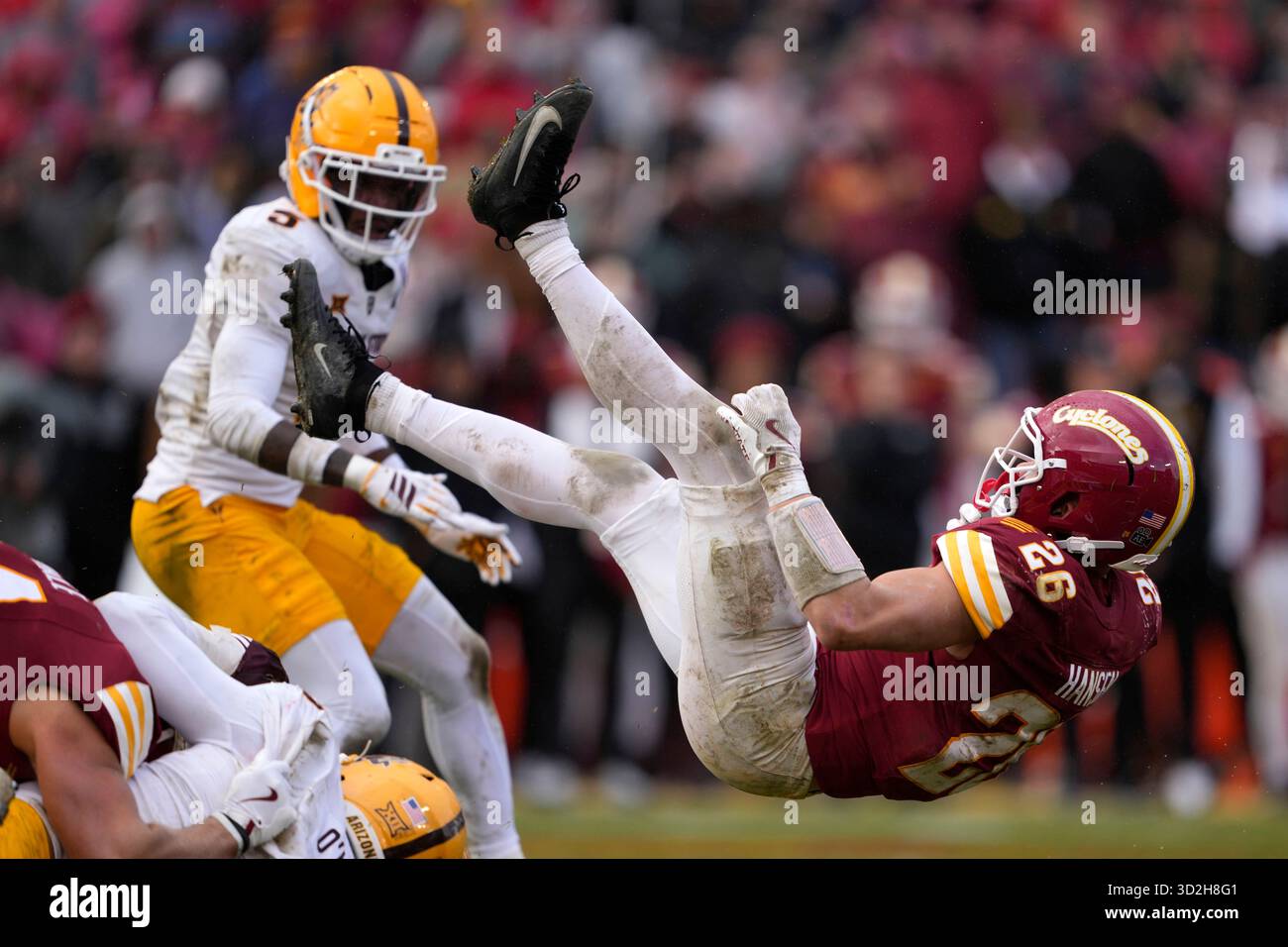 Iowa State running back Carson Hansen (26) is upended during a run in ...