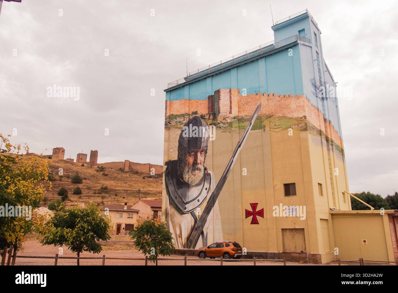 A mural on a grain silo in the Spanish town Molina de Aragón with a ...