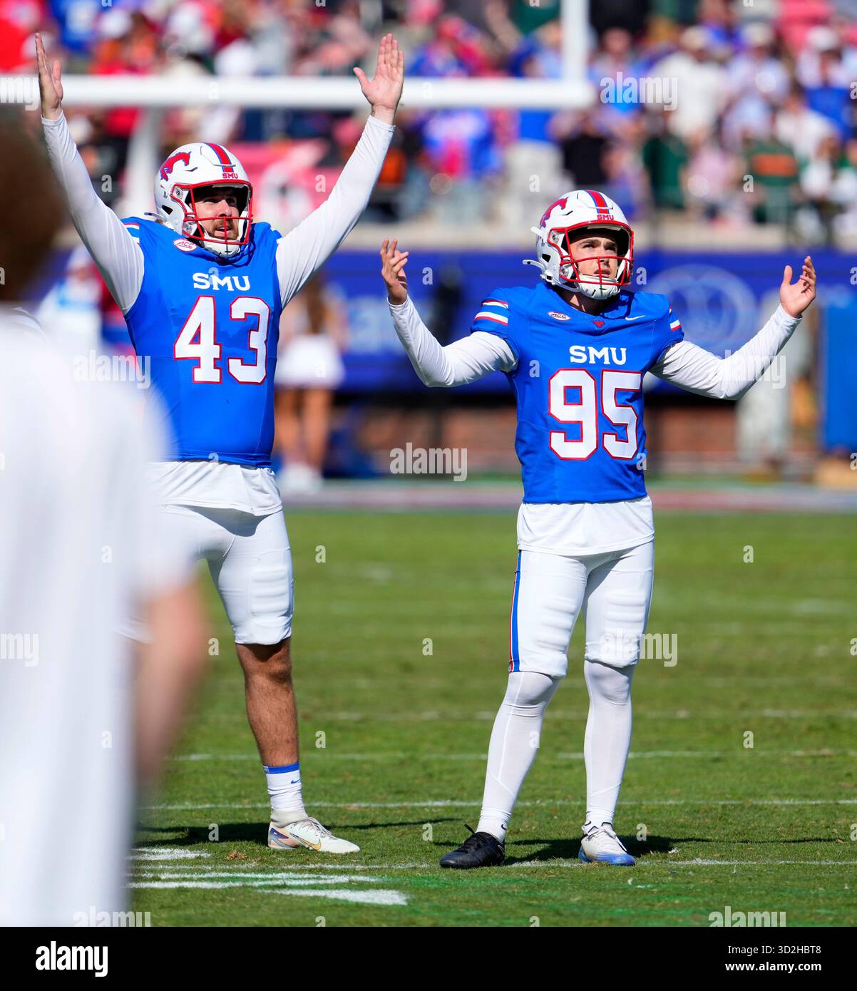 SMU kicker kicker Sam Keltner (95) and holder Wade McSparron (43 ...