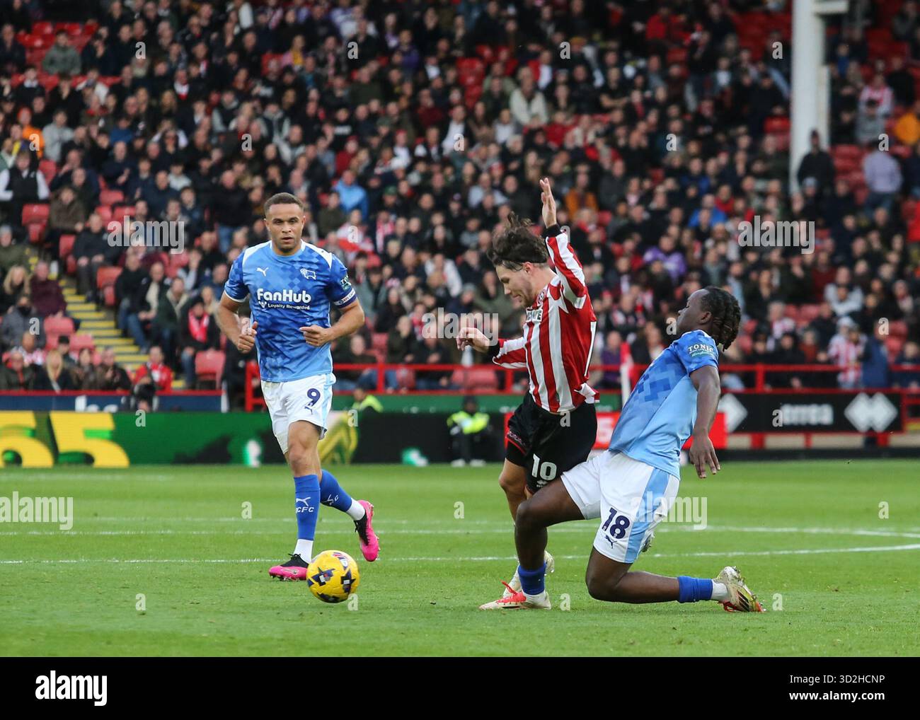 Callum O'Hare of Sheffield United is tackled by David Ozoh of Derby ...