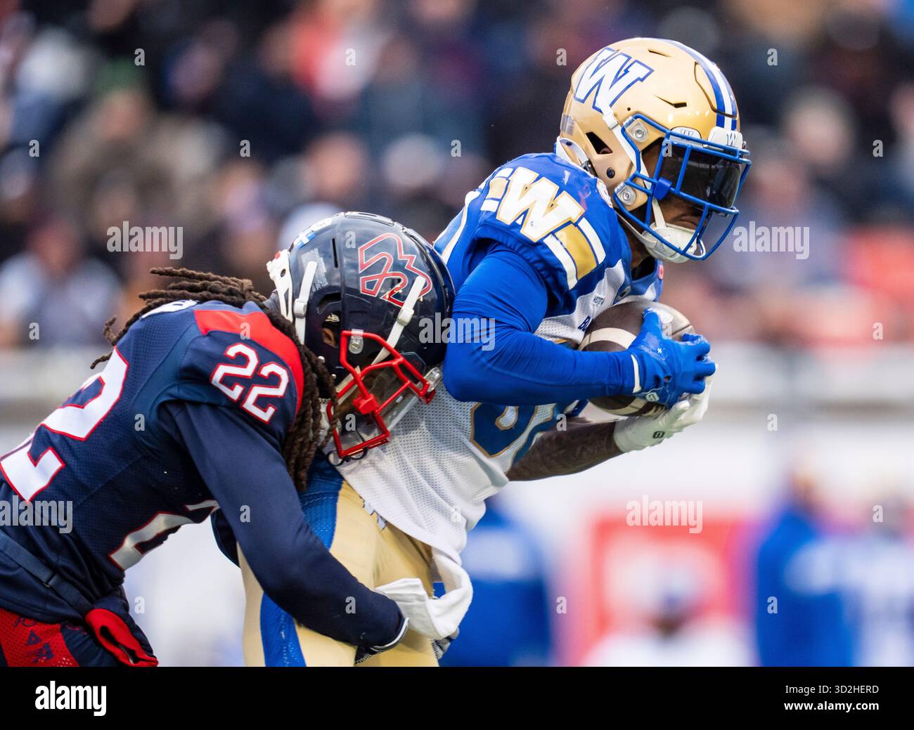 Montreal Alouettes' Dionte Ruffin (22) tackles Winnipeg Blue Bombers ...