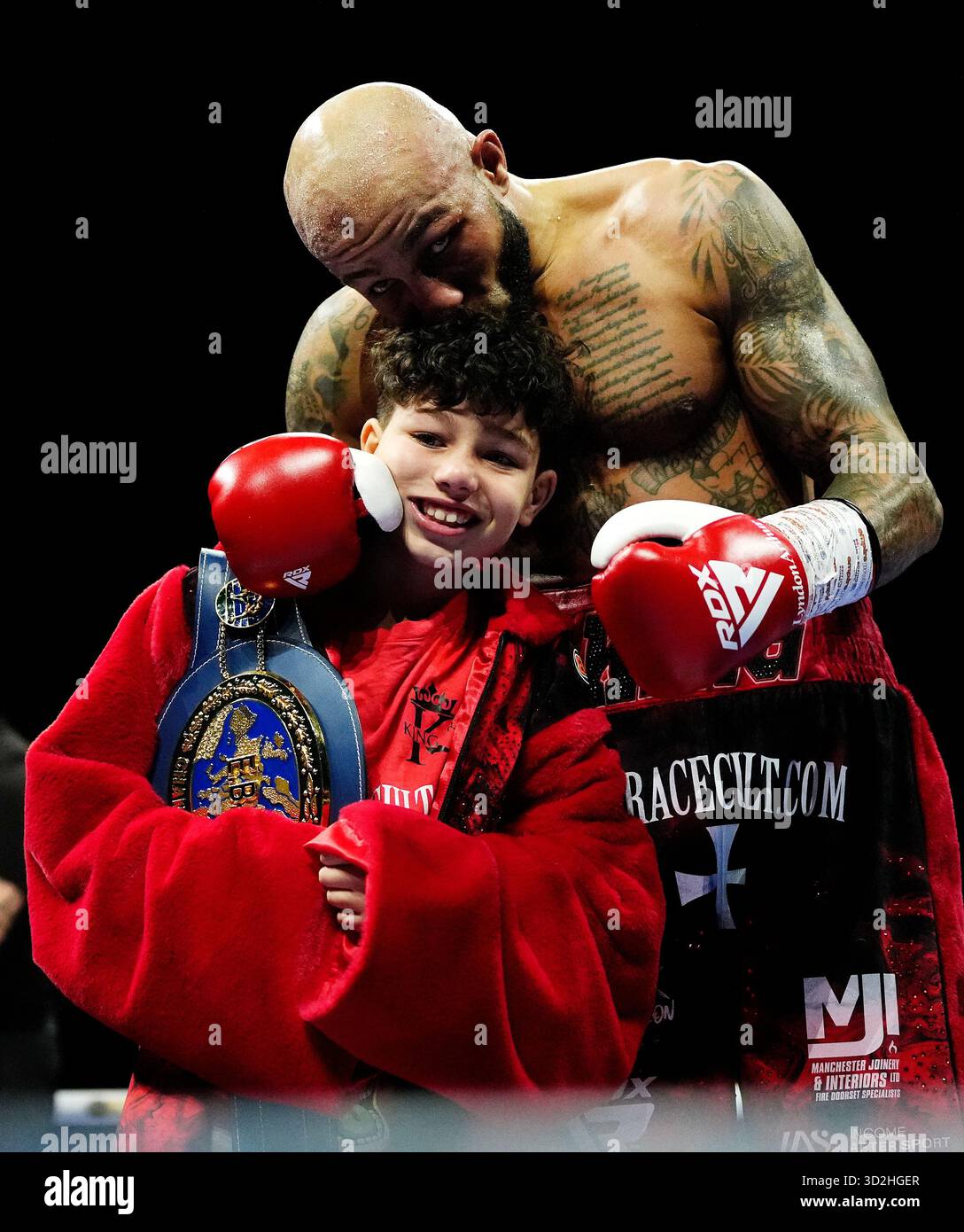 Lyndon Arthur (right) celebrates with his son after winning their EBU ...