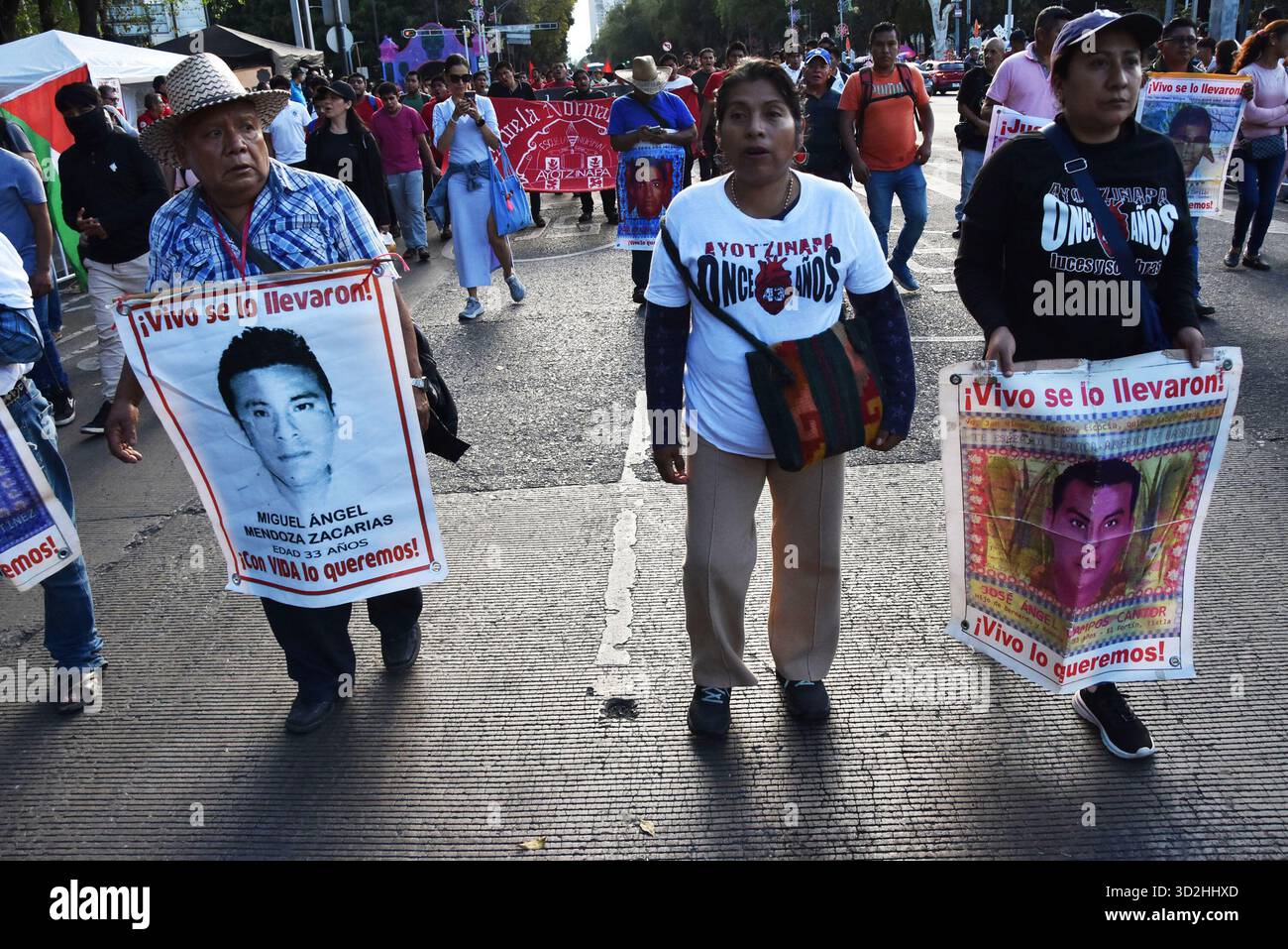 Carrying photos of disappeared students hi-res stock photography and ...