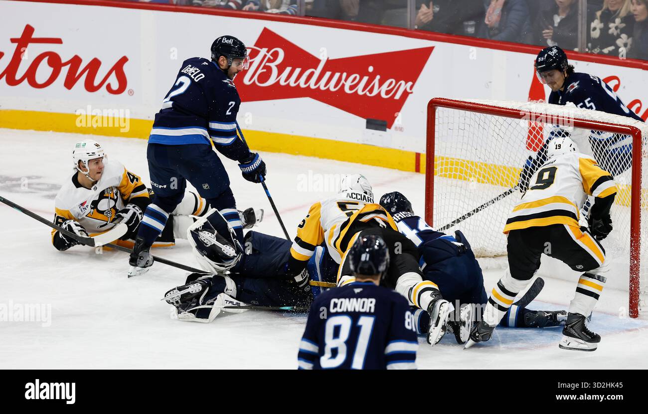 Pittsburgh Penguins' Blake Lizotte (46), left, looks on as his shot ...