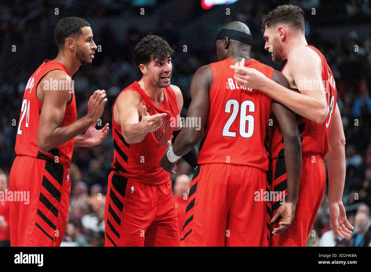 Portland Trail Blazers forward Deni Avdija, center, communicates with ...