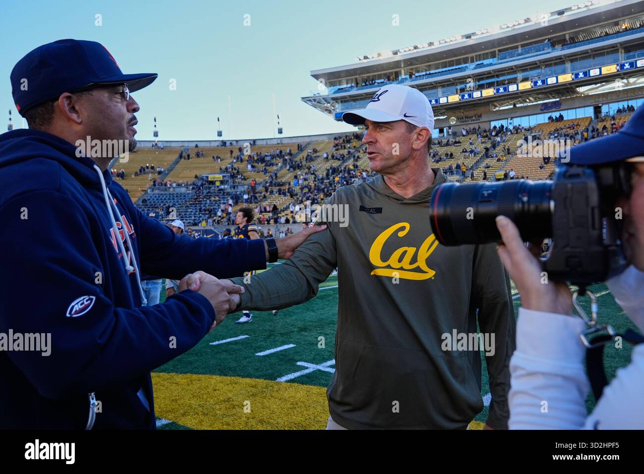 Virginia head coach Tony Elliott, left, and California head coach ...