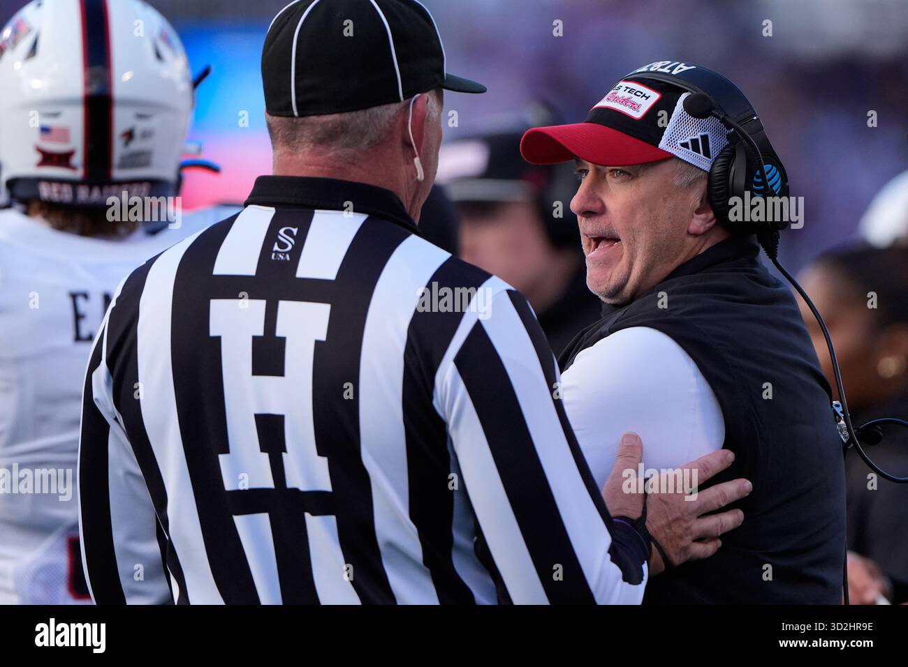 Texas Tech head coach Joey McGuire talks to an official during the ...