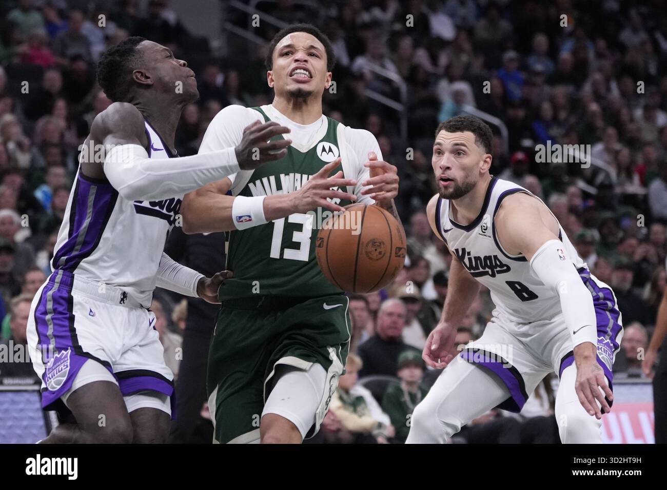 Milwaukee Bucks' Ryan Rollins loses the ball as he drives between ...