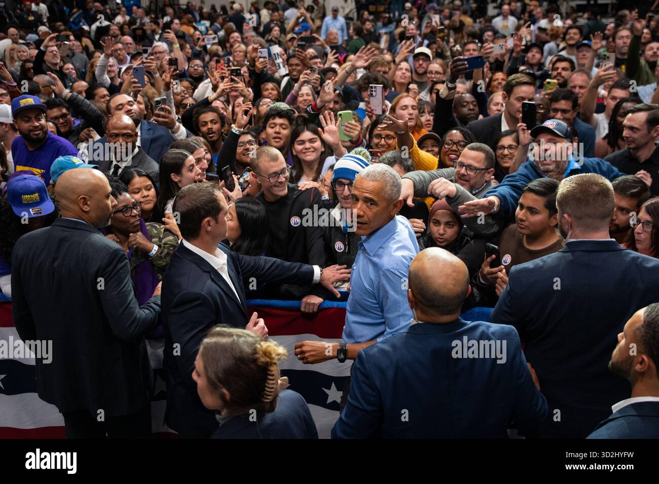 Former President Barack Obama greets supporters at the end of a rally ...