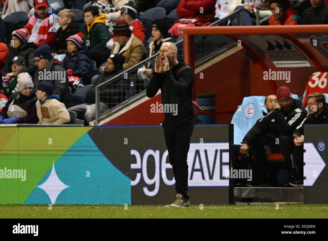 Chicago Fire head coach Gregg Berhalter yells to his players from the ...