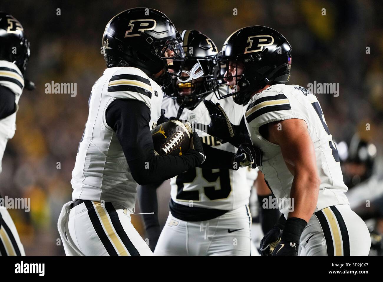 Purdue defensive back Hudauri Hines, left, celebrates with defensive ...