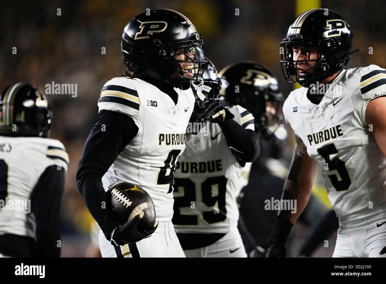 Purdue defensive back Hudauri Hines, left, celebrates with linebacker ...