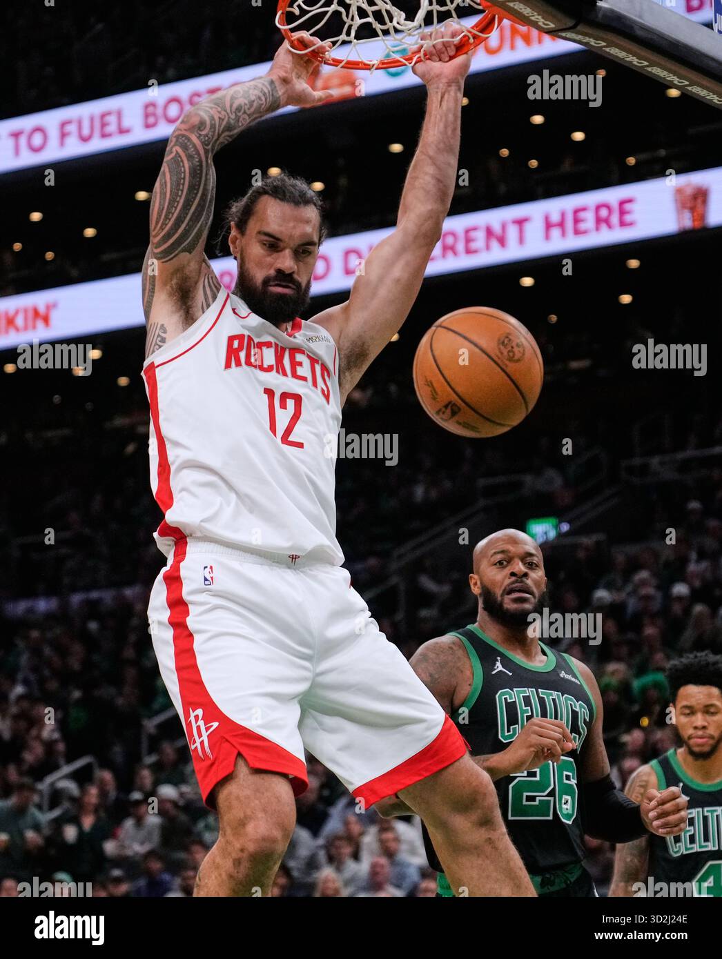 Houston Rockets center Steven Adams (12) dunks against Boston Celtics ...