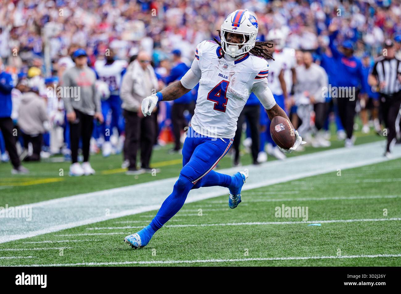 Buffalo Bills running back James Cook III (4) runs with the ball for a ...