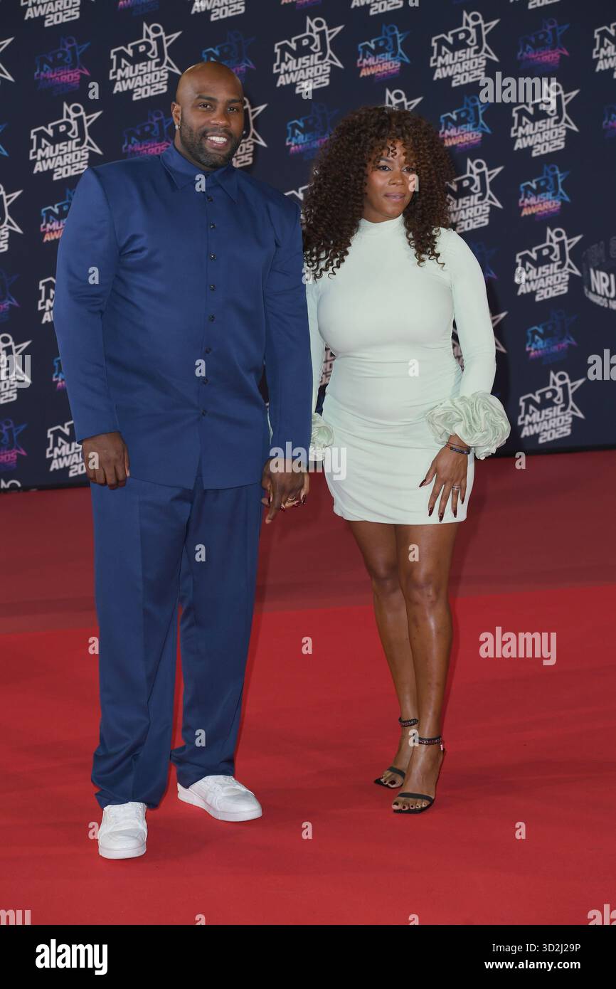 Teddy Riner and Luthna Plocus attend the Photocall during the 27th NRJ ...