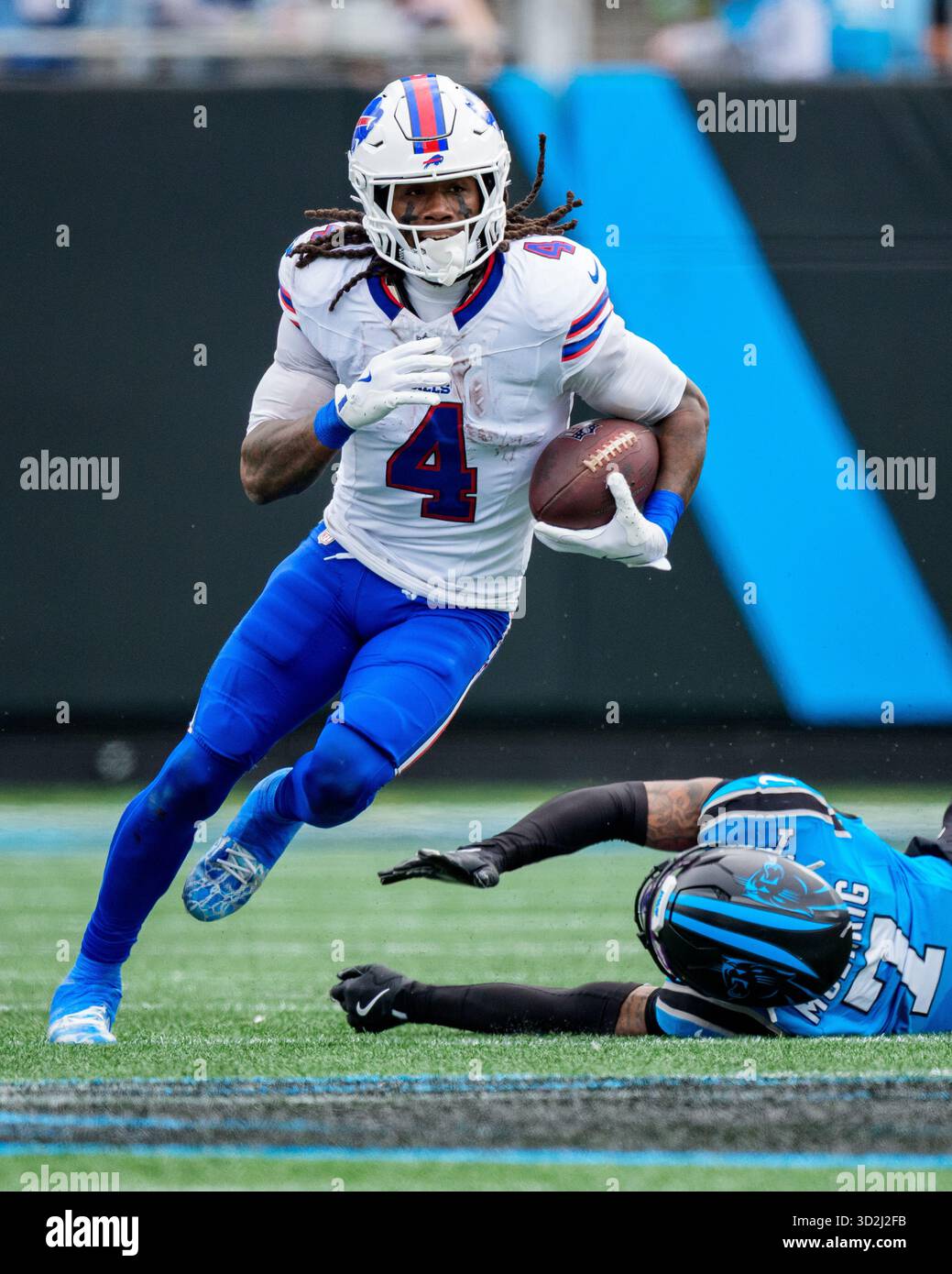 Buffalo Bills running back James Cook III (4) runs past Carolina ...