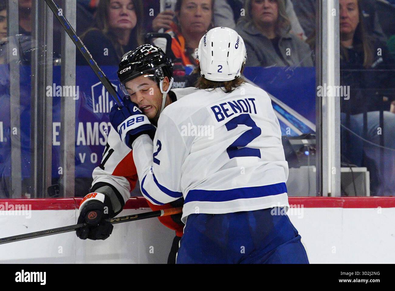 Toronto Maple Leafs' Simon Benoit (2) checks Philadelphia Flyers' Tyson ...