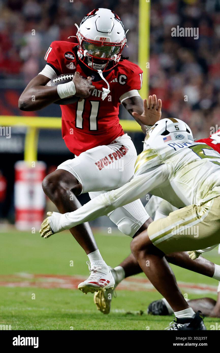 North Carolina State quarterback CJ Bailey (11) runs the ball as ...