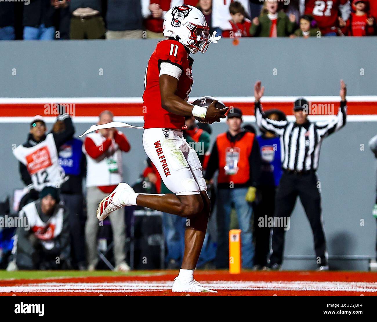 November 1, 2025: NC State quarterback CJ Bailey (11) hops over the ...