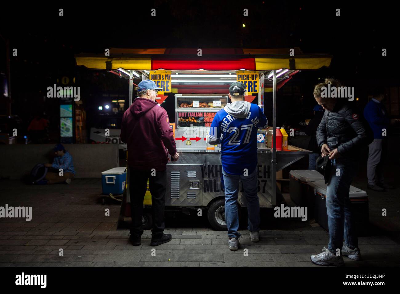 Baseball fans visit a food truck ahead of World Series Game 7 between ...