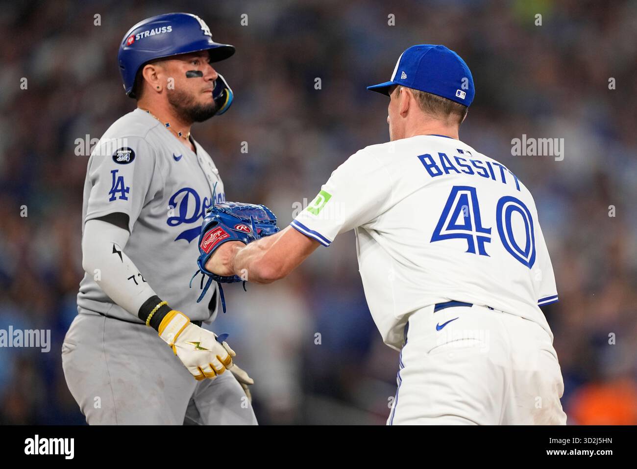 Toronto Blue Jays pitcher Chris Bassitt tags out Los Angeles Dodgers ...