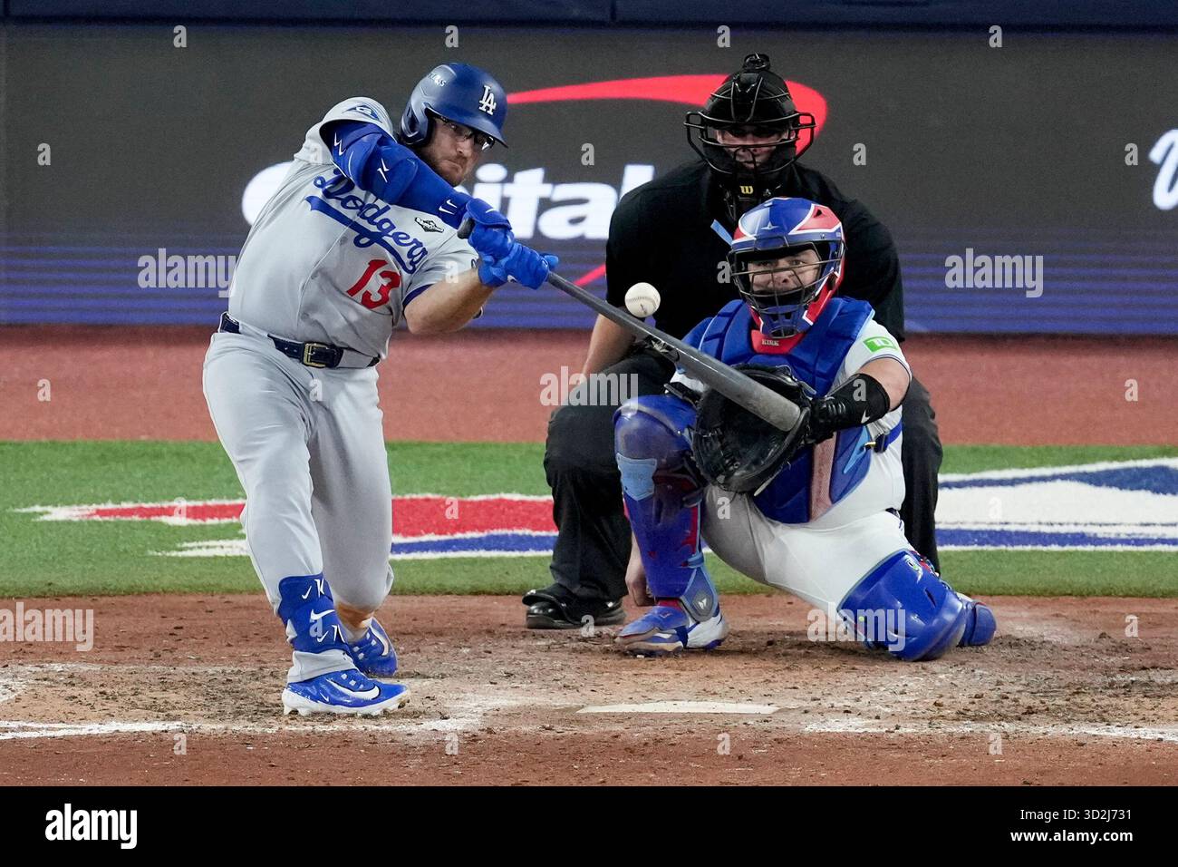 Los Angeles Dodgers' Max Muncy connects for a home run against the Toronto Blue Jays during the ...