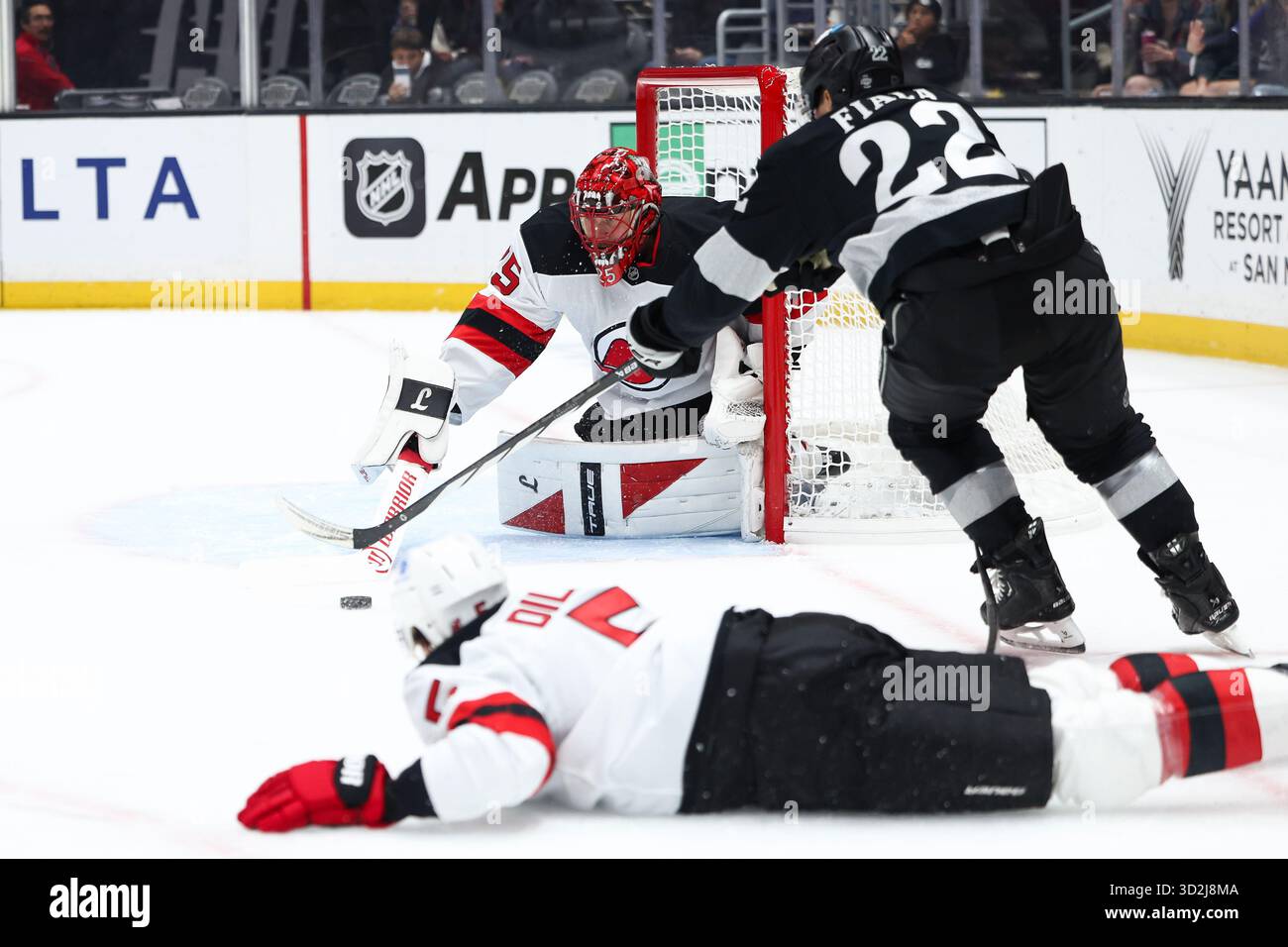 New Jersey Devils goaltender Jacob Markstrom (25), back, defends the ...