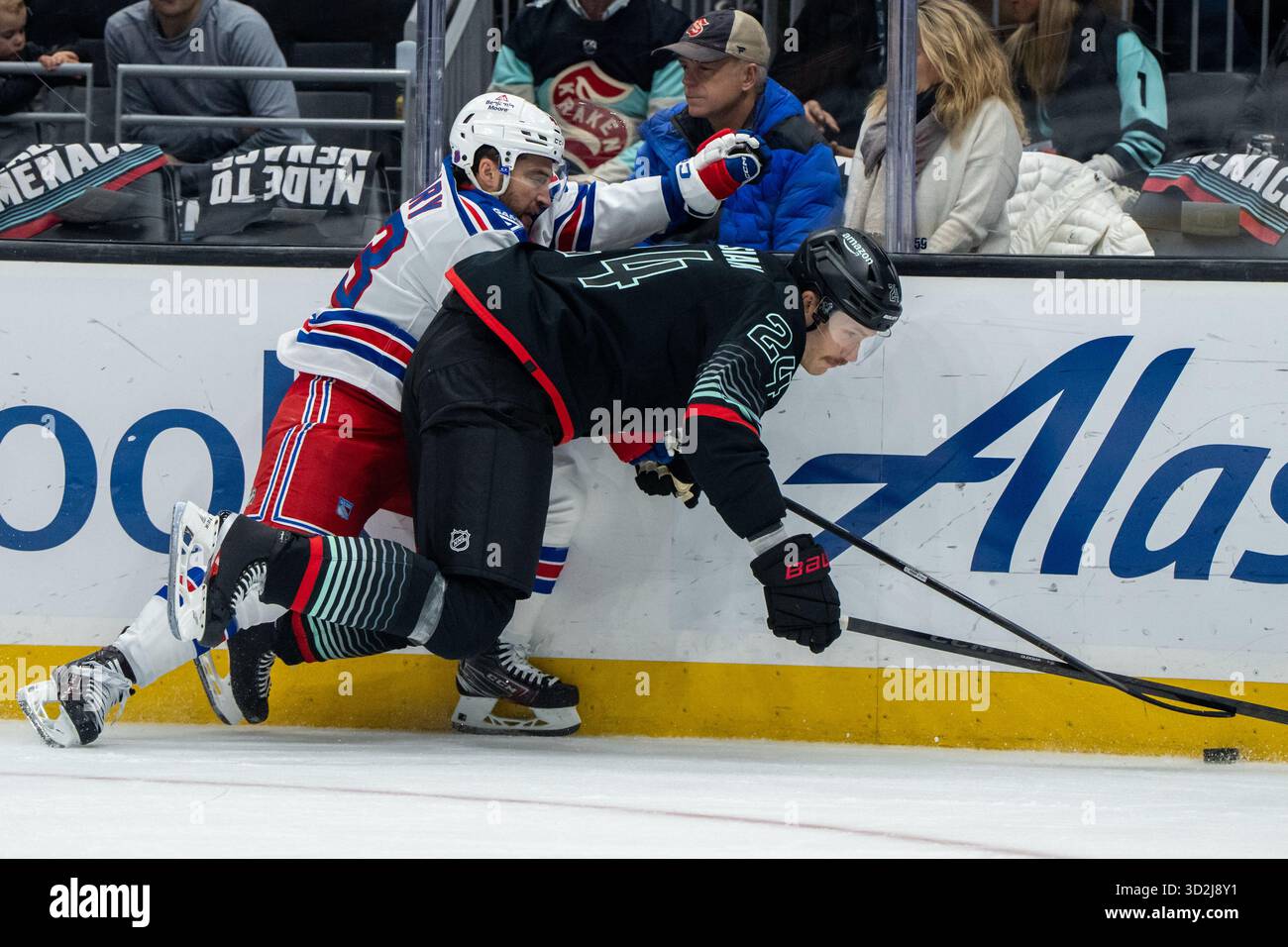 Seattle Kraken defenseman Jamie Oleksiak, right, and New York Rangers ...