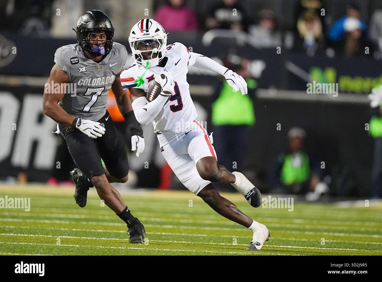 Arizona defensive back Ayden Garnes runs after intercepting a pass as ...