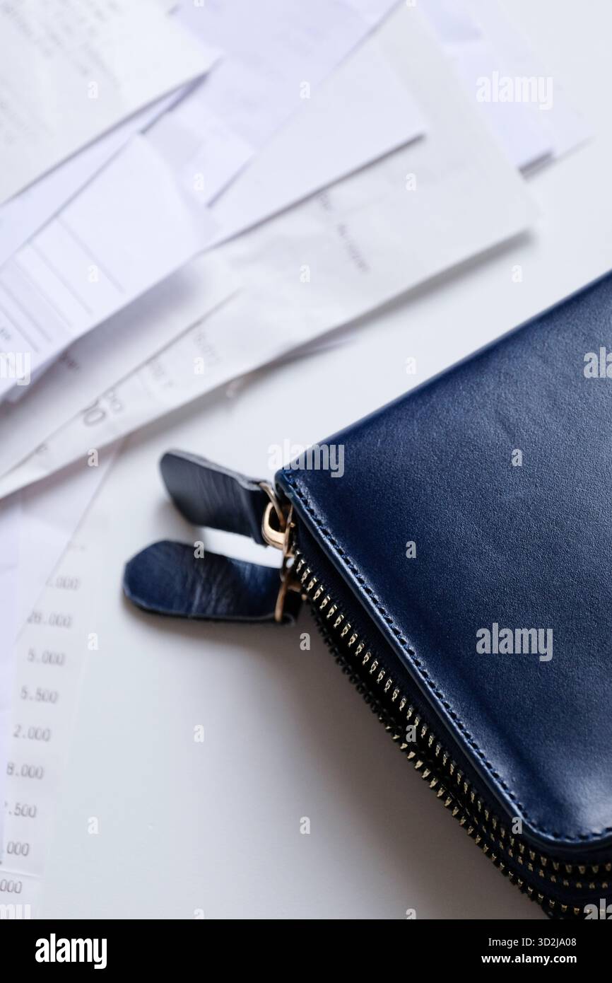 Take out a stack of payment receipts from the wallet Stock Photo - Alamy