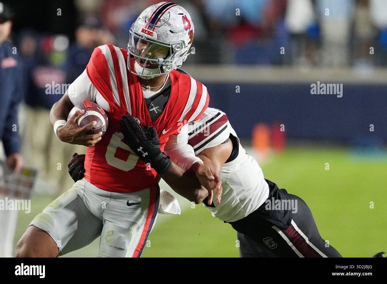 Mississippi quarterback Trinidad Chambliss (6) tries to evade a tackle ...