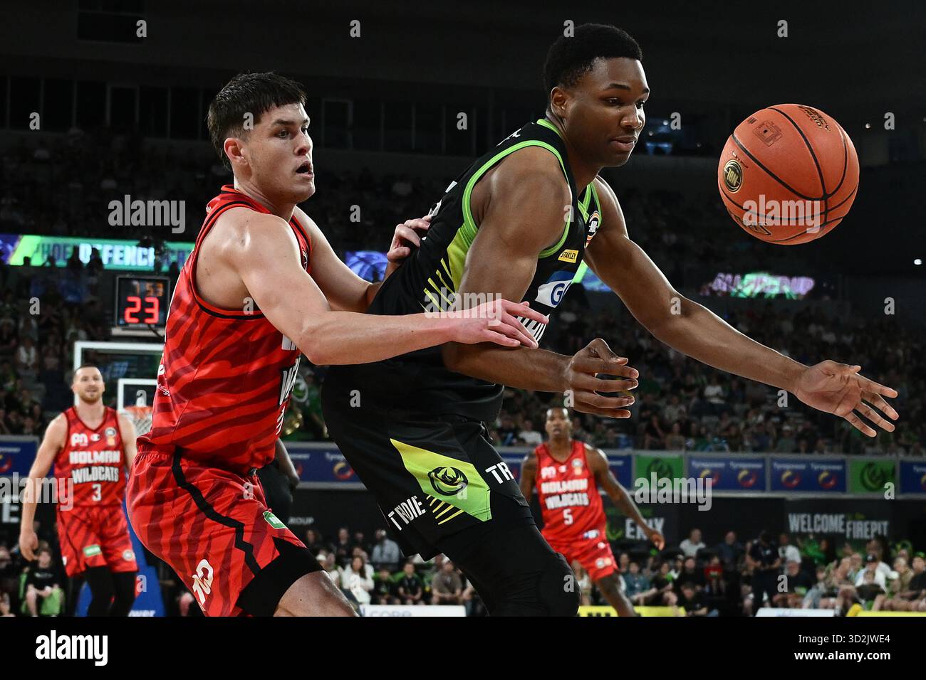 Ben Henshall of the Wildcats (left) and Malique Lewis of the Phoenix ...