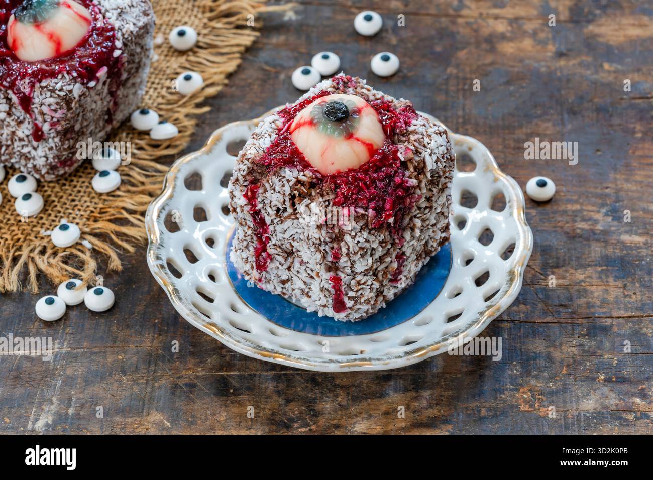 Halloween Lamington cakes decorated with jelly monster eye Stock Photo ...