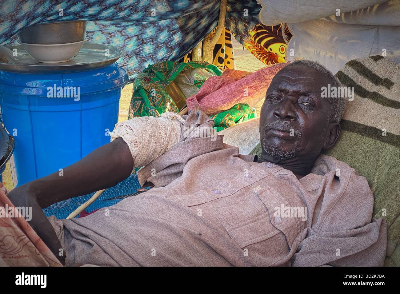 An injured Sudanese man who fled el-Fasher city, after Sudan's ...
