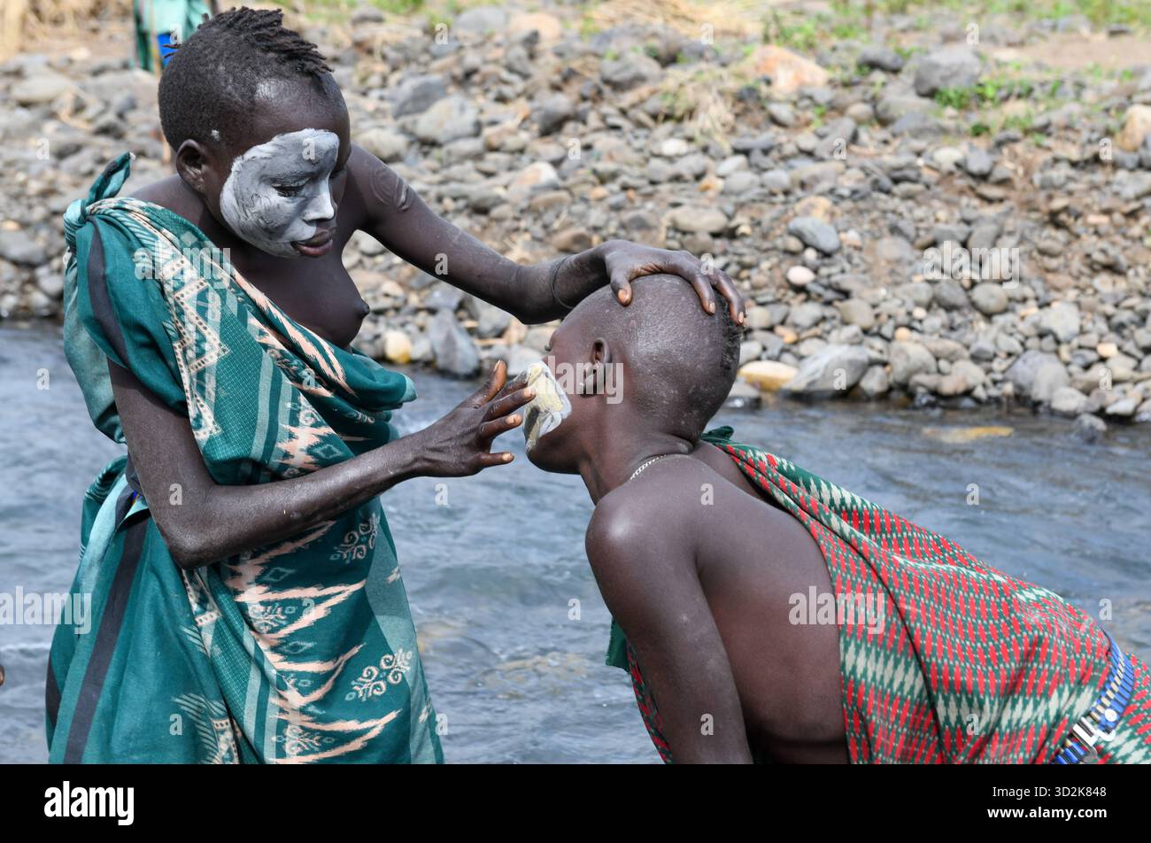 Kibish, Ethiopia - 12 August 2025: childs painting them faces at Suri ...