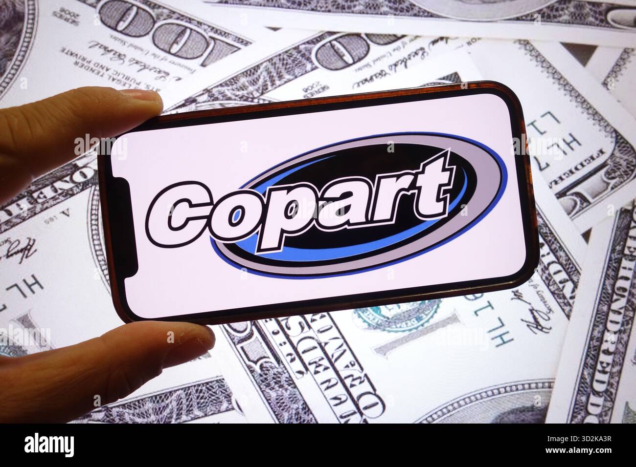 In this photo illustration, the Copart company logo is seen displayed ...