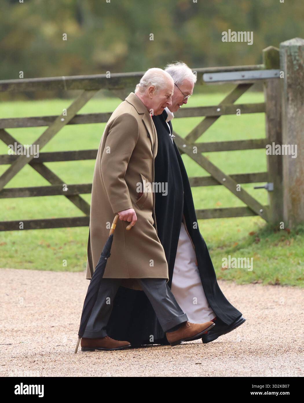 King Charles III is greeted by Revd Canon Dr Paul Williams (behind) as ...
