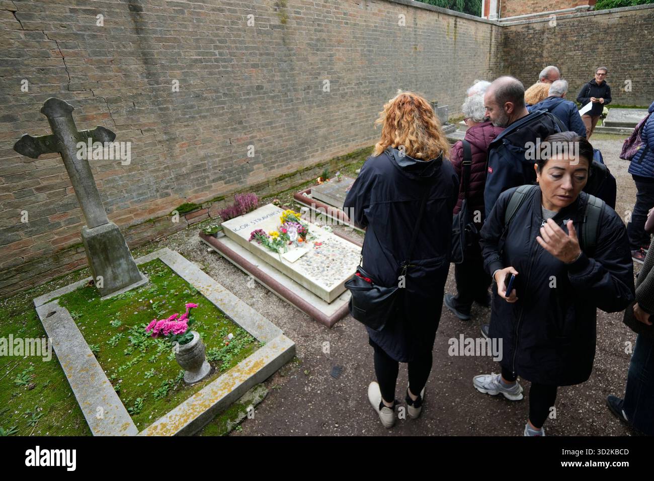 Visitors pay respect to the grave of Igor Stravinsky at the San Michele ...