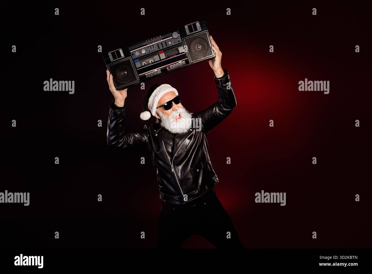 Rocker santa wearing leather jacket rocks a retro boombox above head in ...