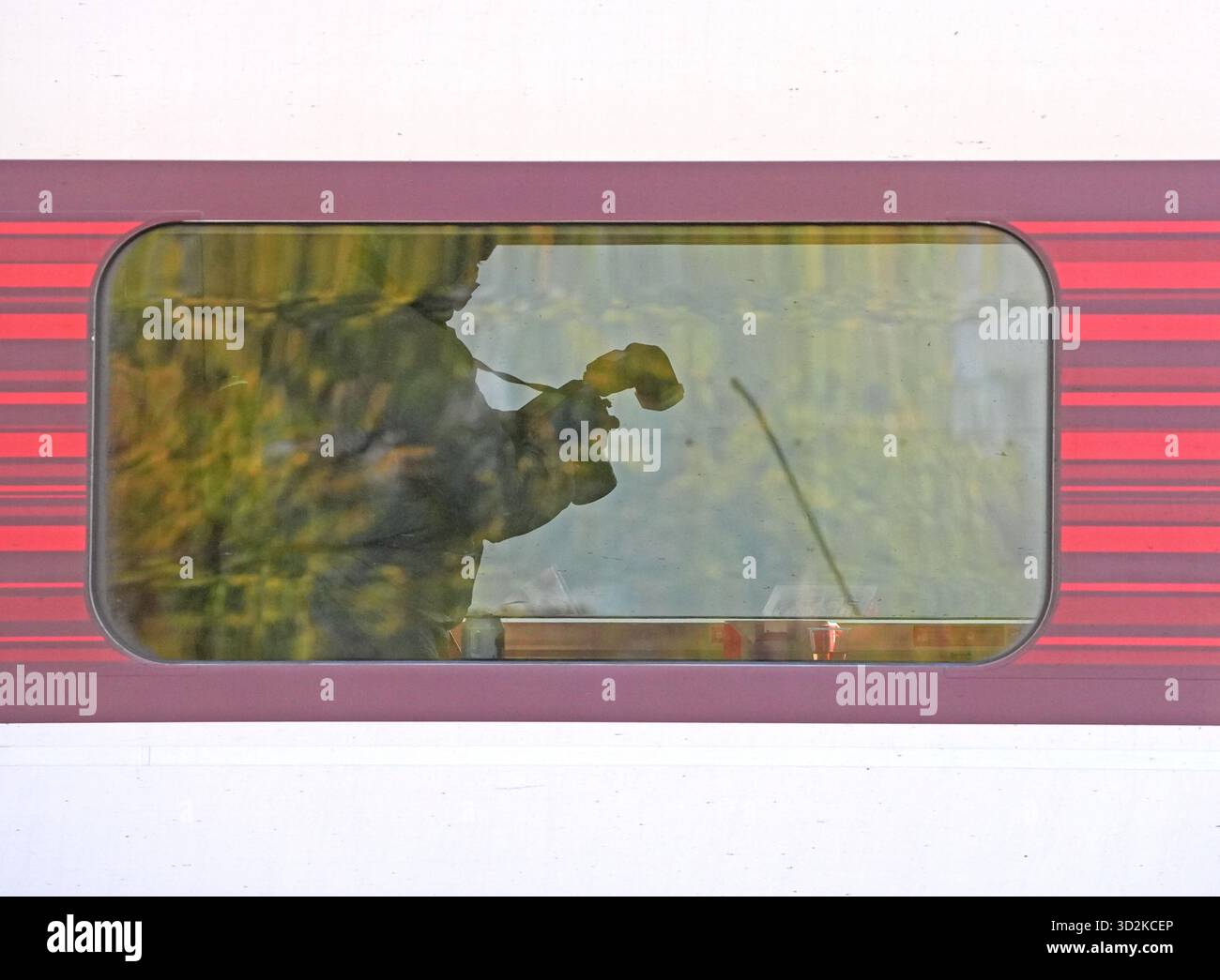 A forensic investigator photographing inside the train at Huntingdon ...