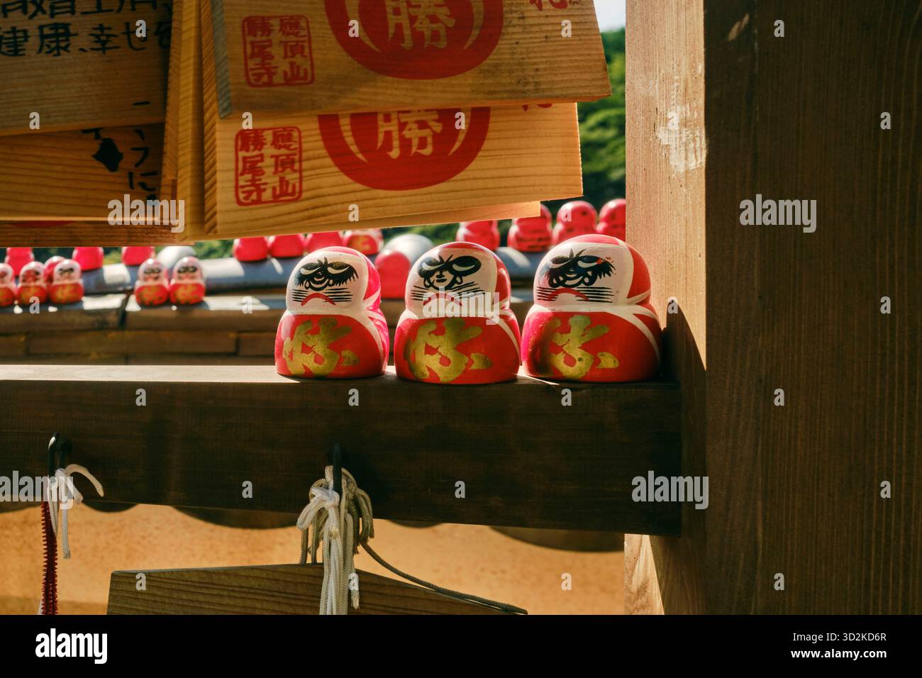 A stack of traditional Daruma dolls at Katsuoji Temple in Osaka, Japan ...