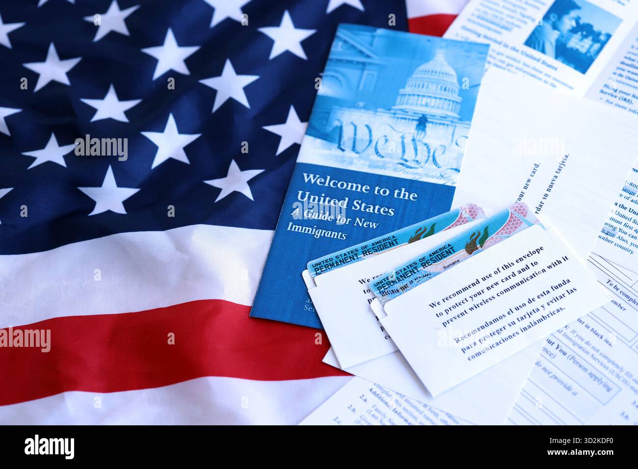 Permanent resident green card in envelope with application and guide ...