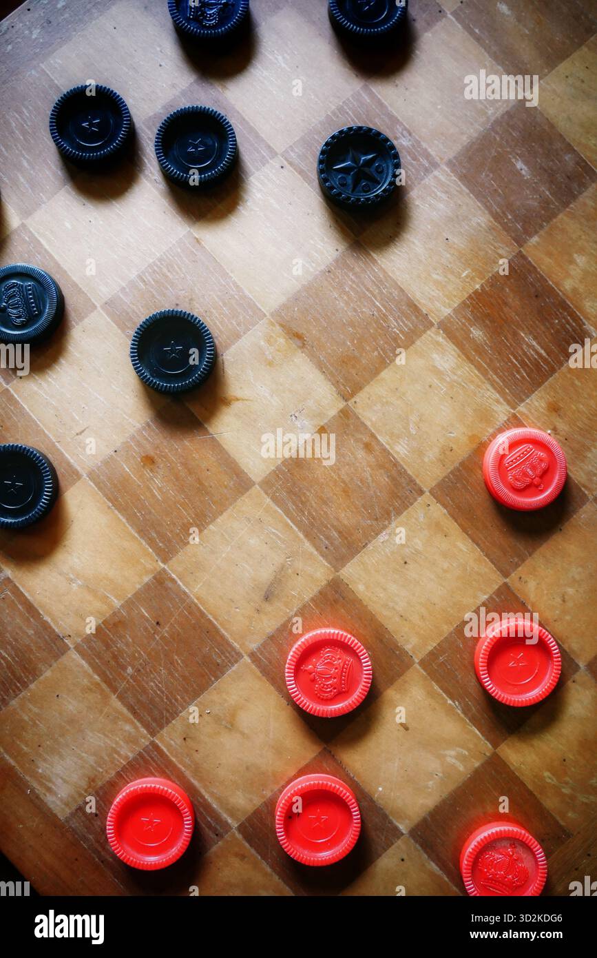 Old worn checkerboard game Stock Photo - Alamy